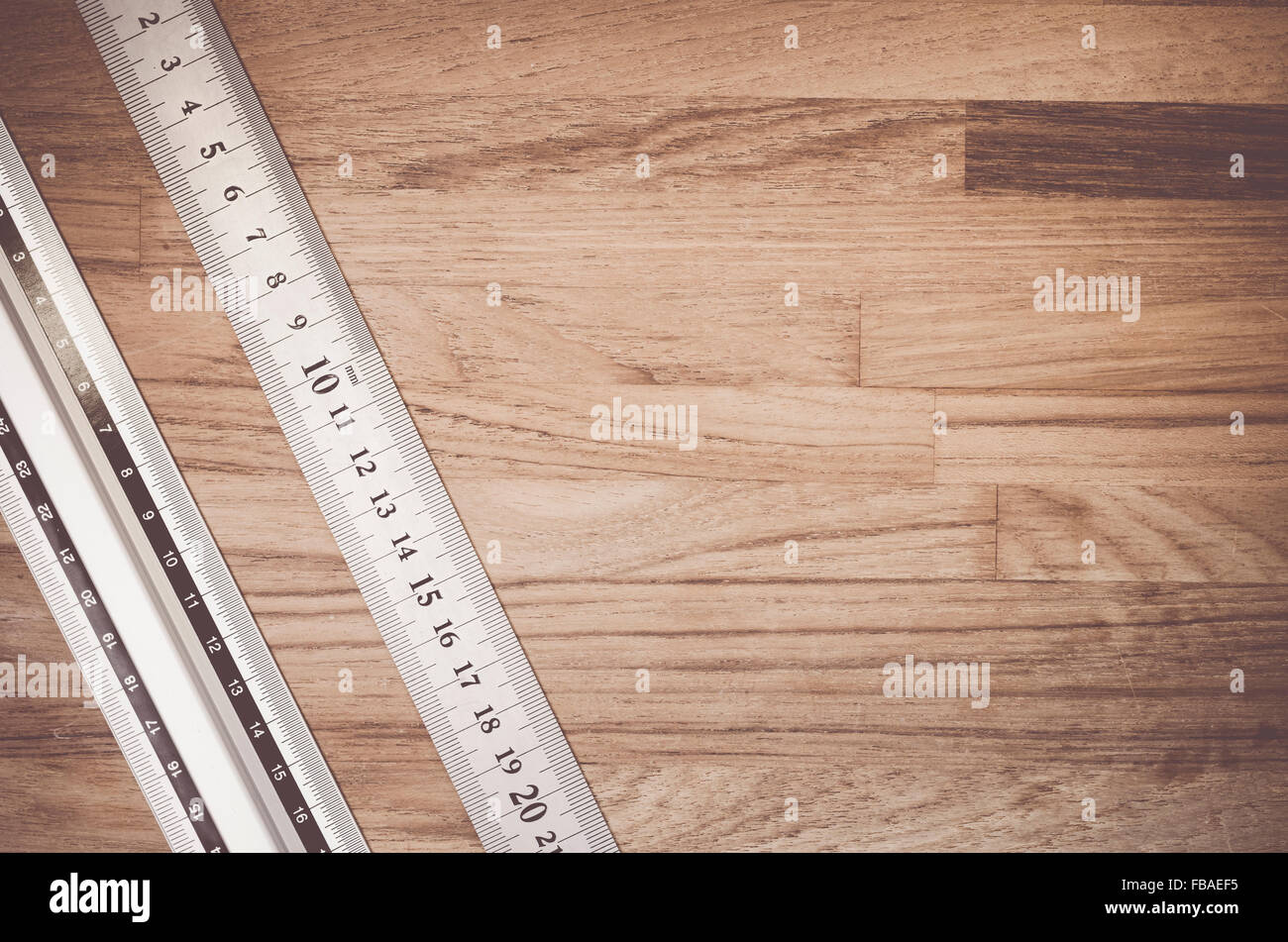 metallic yardstick close up on a wood surface - measure concept Stock ...