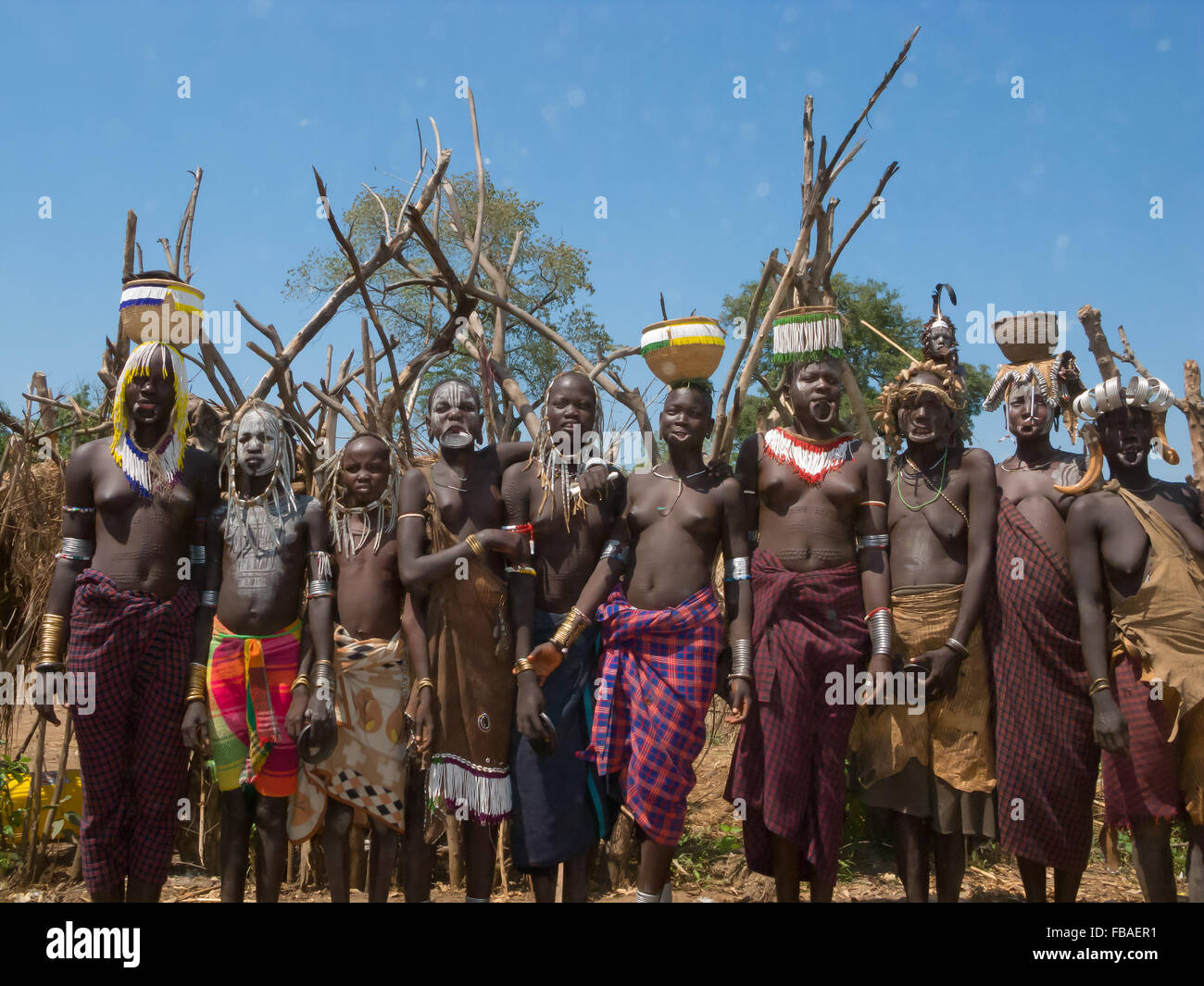 The Mursi women are famous of wearing plates in their lower lips ...