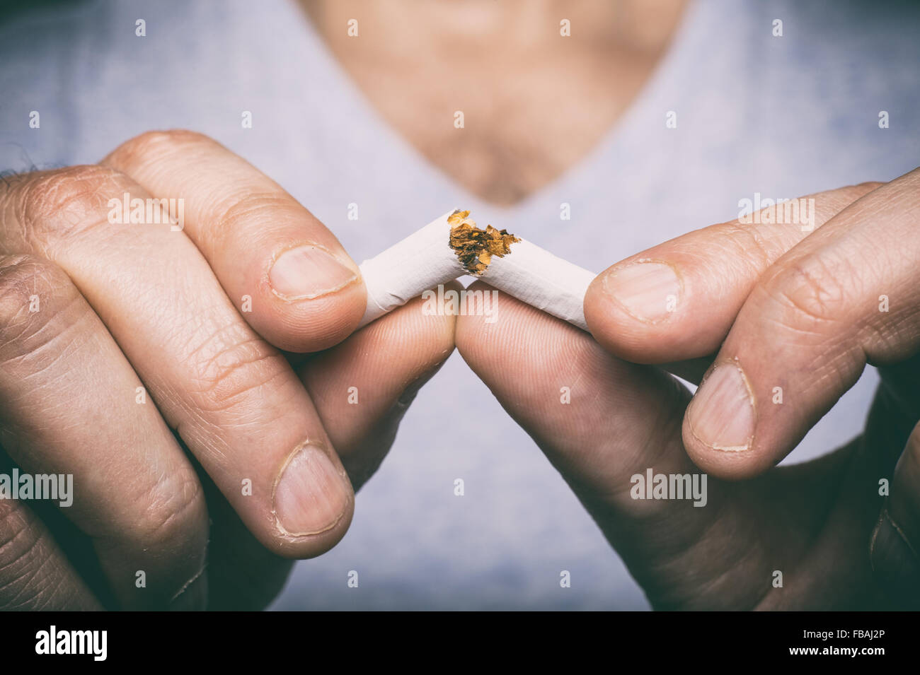 Quitting smoking - male hand crushing cigarette Stock Photo - Alamy Quitting smoking - male hand crushing cigarette Stock Photo - Alamy