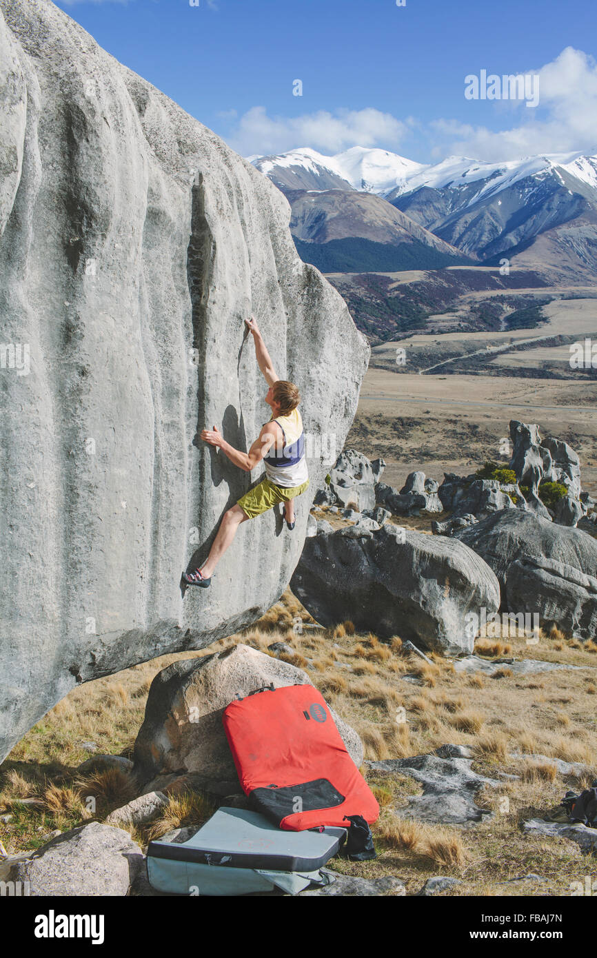 Man rock climbing up mountain hi-res stock photography and images - Alamy