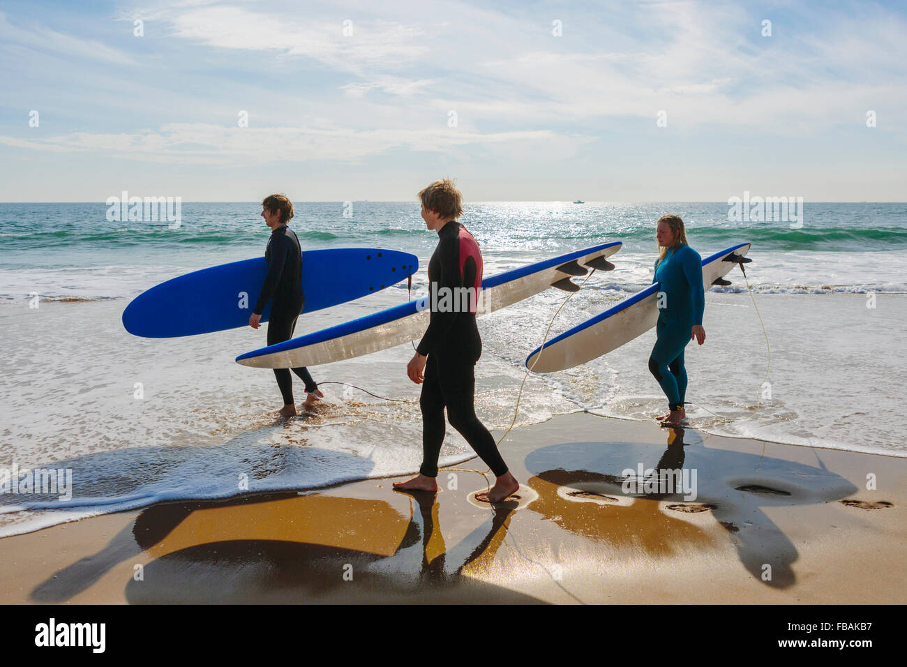 Three men on beach hi-res stock photography and images - Alamy