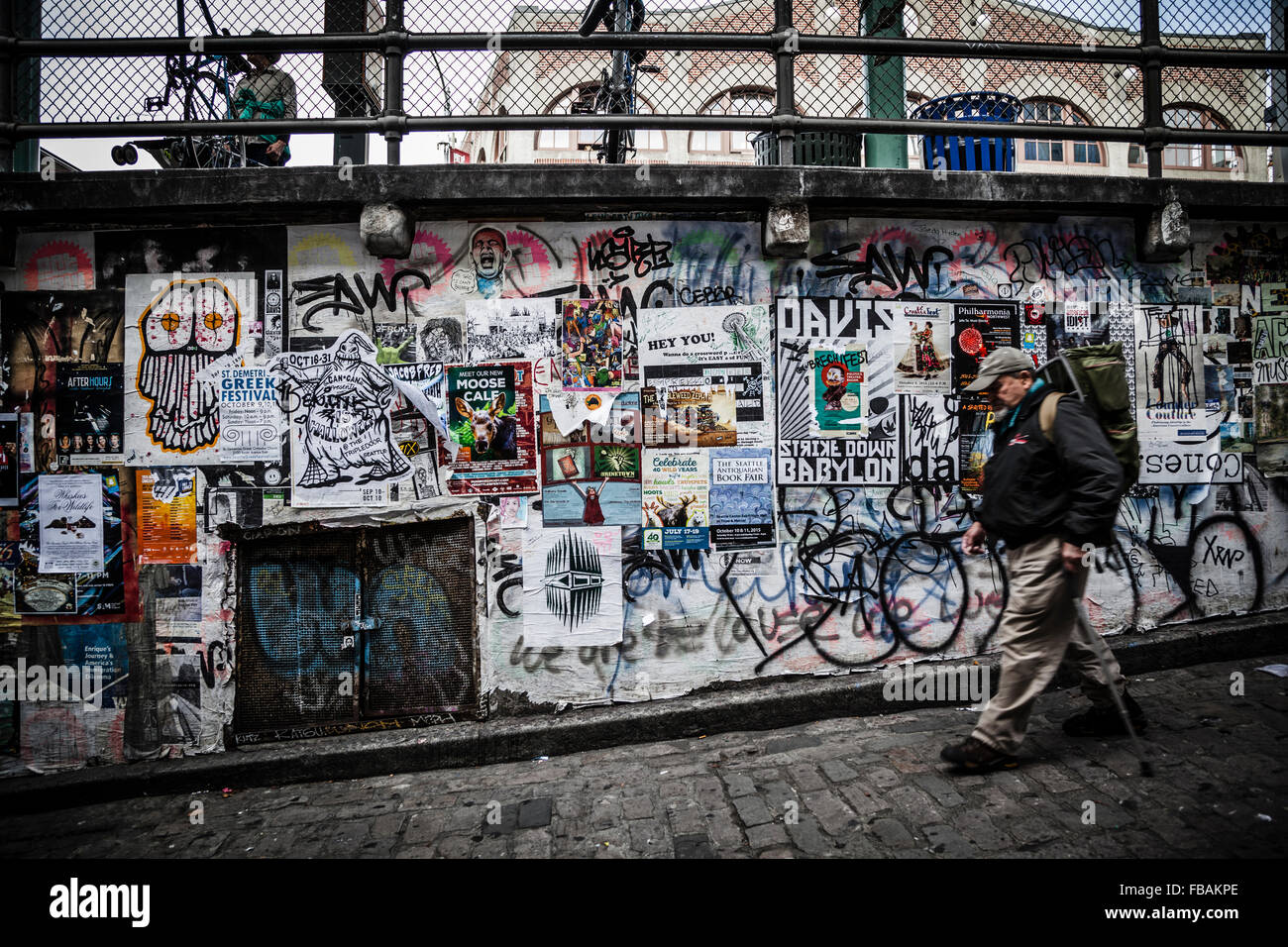 Man walking to the Post Alley under Pike Place Market, Seattle ...