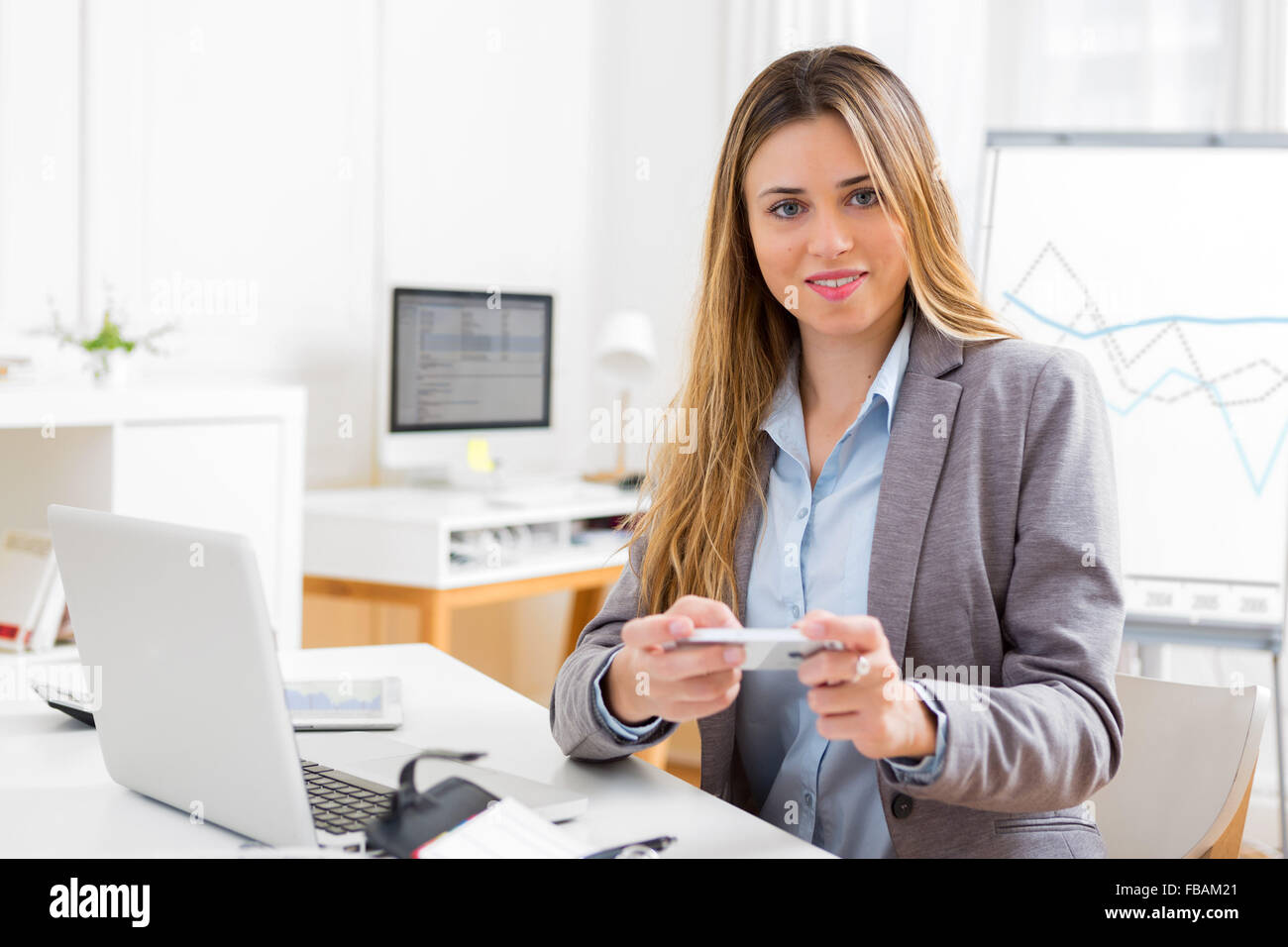 View of a Young attractive woman working at the office Stock Photo - Alamy