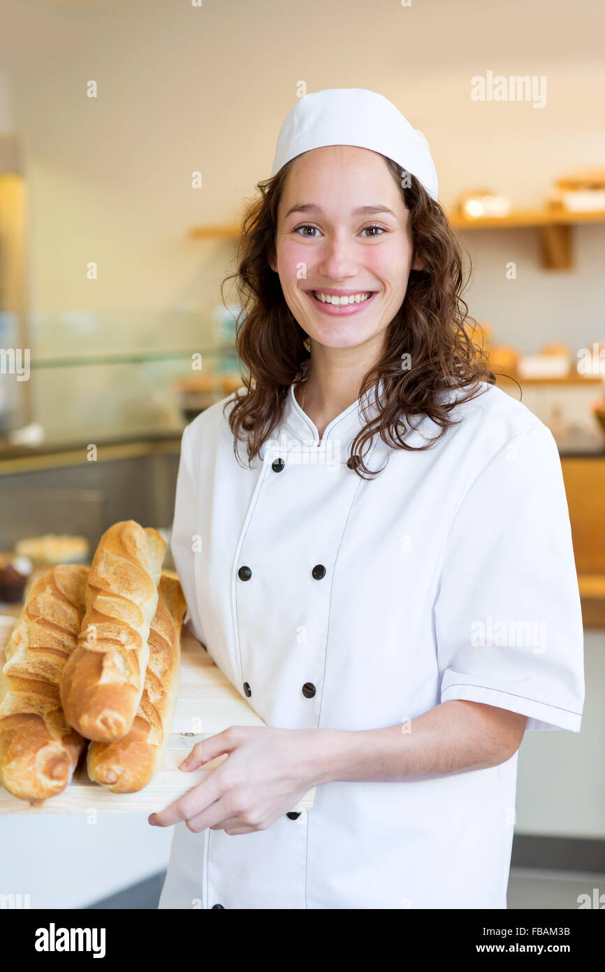 View of an Young attarctive baker working at the bakery Stock Photo - Alamy