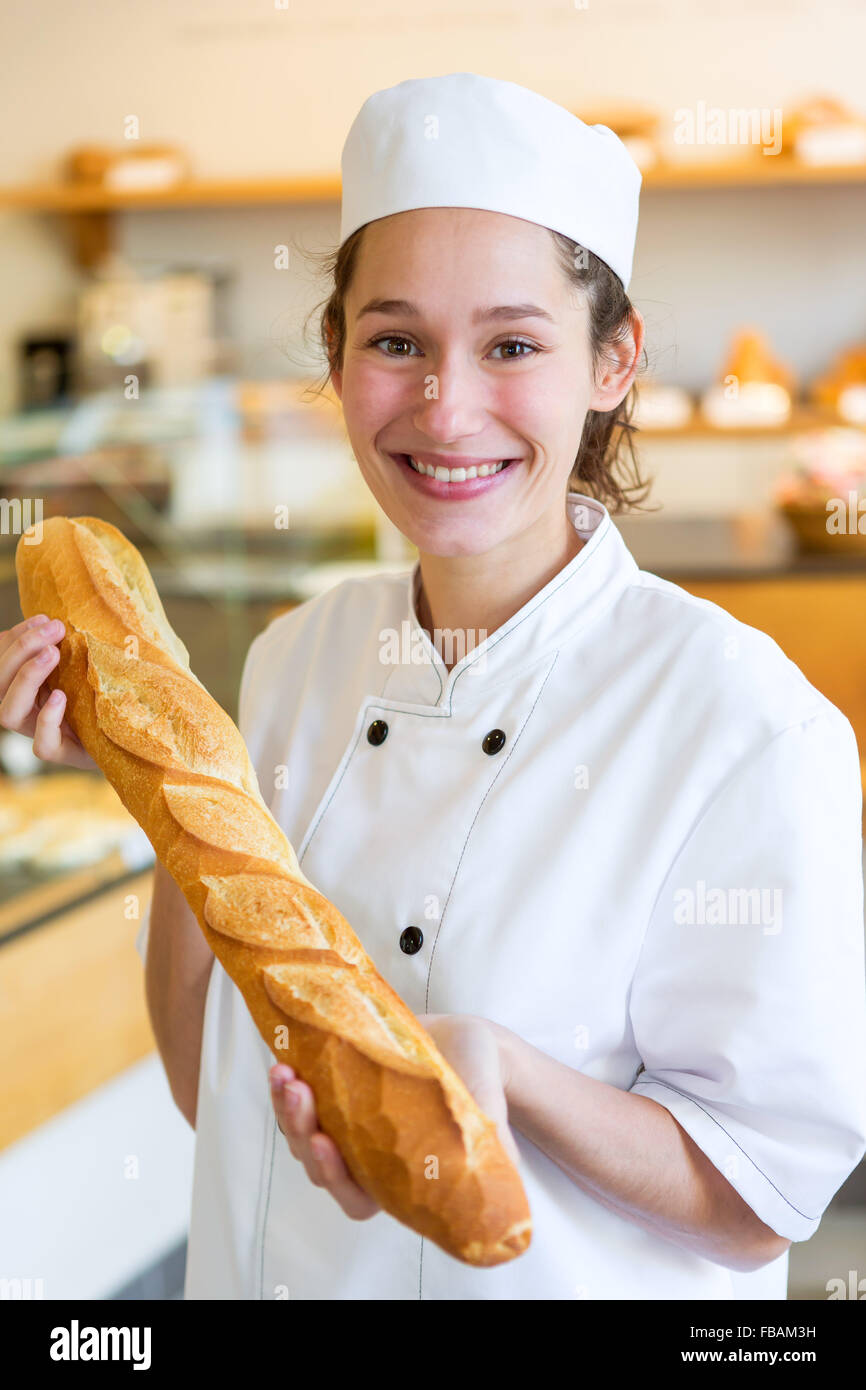 View of an Young attarctive baker working at the bakery Stock Photo - Alamy