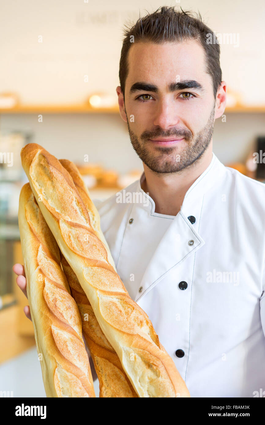 VIew of a Young attarctive baker working at the bakery Stock Photo - Alamy