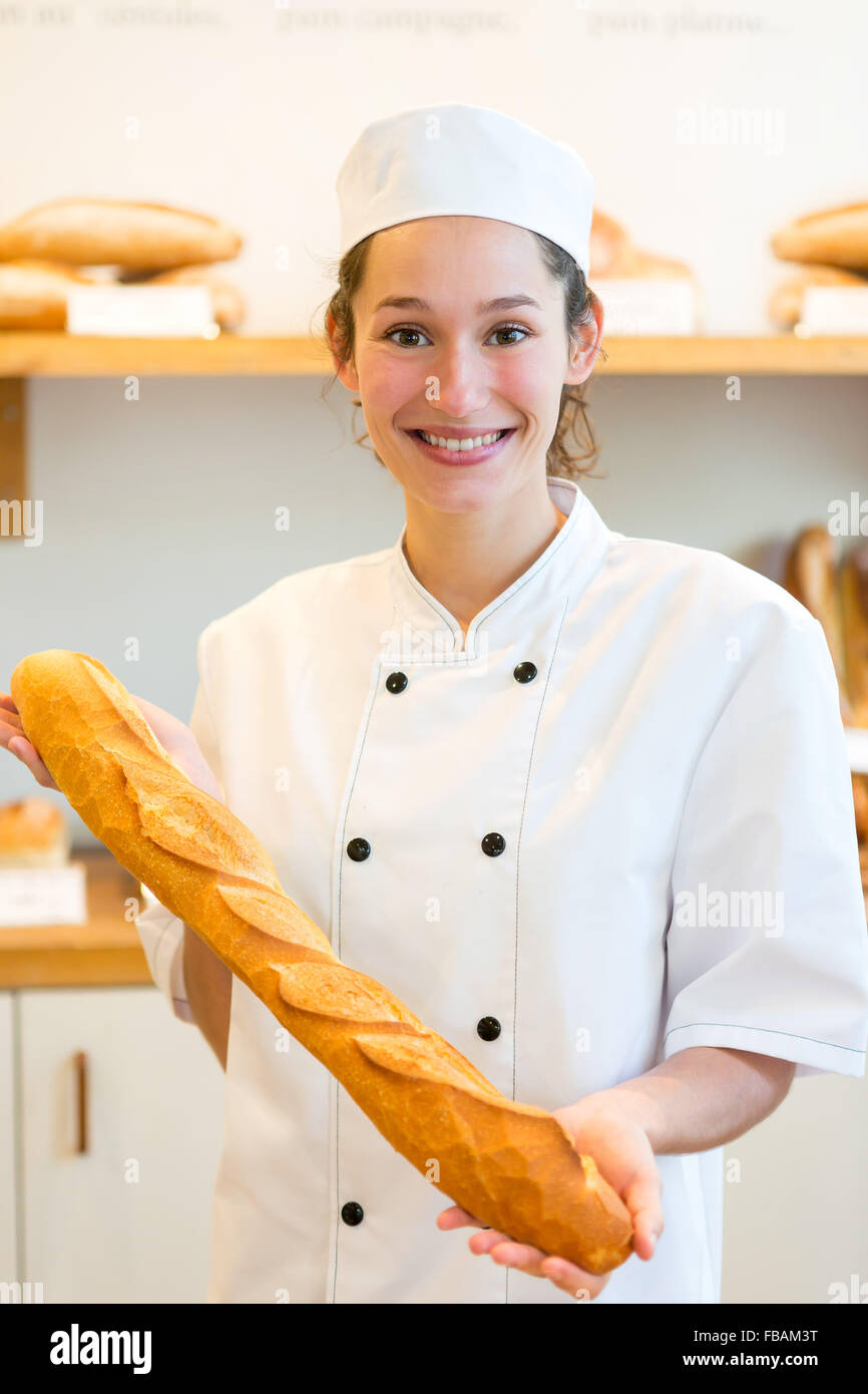 View of an Young attarctive baker working at the bakery Stock Photo - Alamy