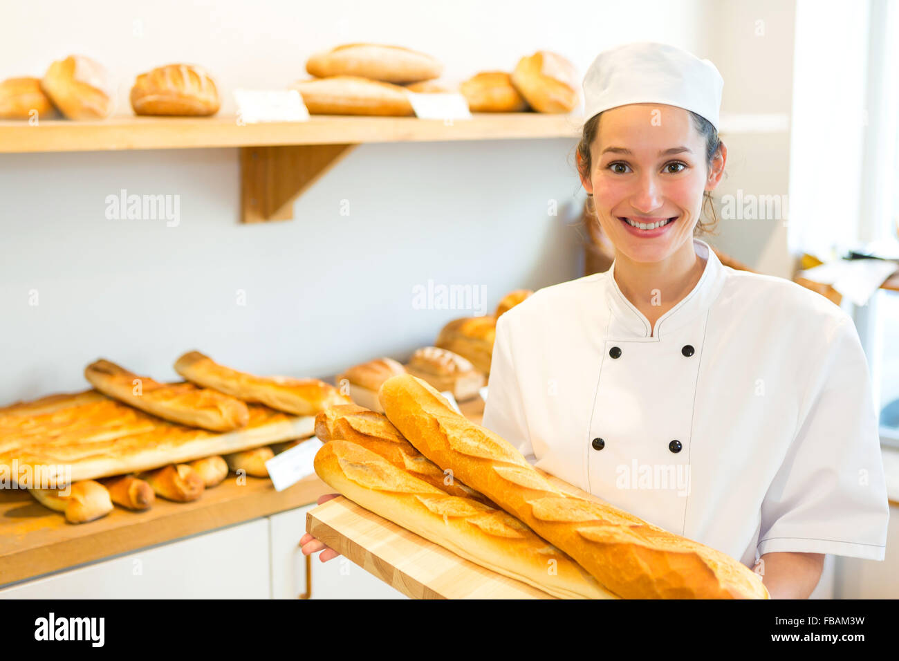 View of an Young attarctive baker working at the bakery Stock Photo - Alamy
