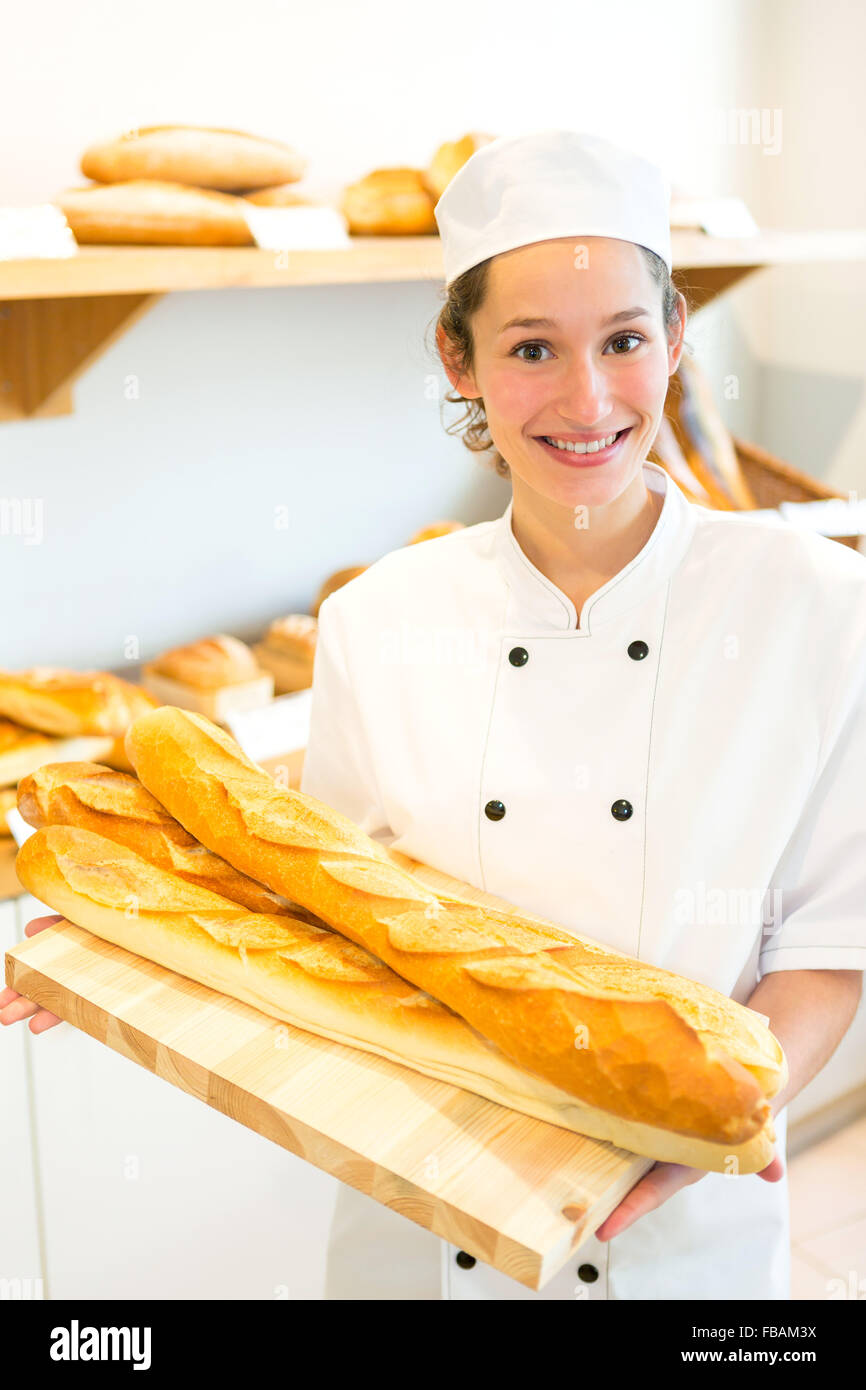View of an Young attarctive baker working at the bakery Stock Photo - Alamy