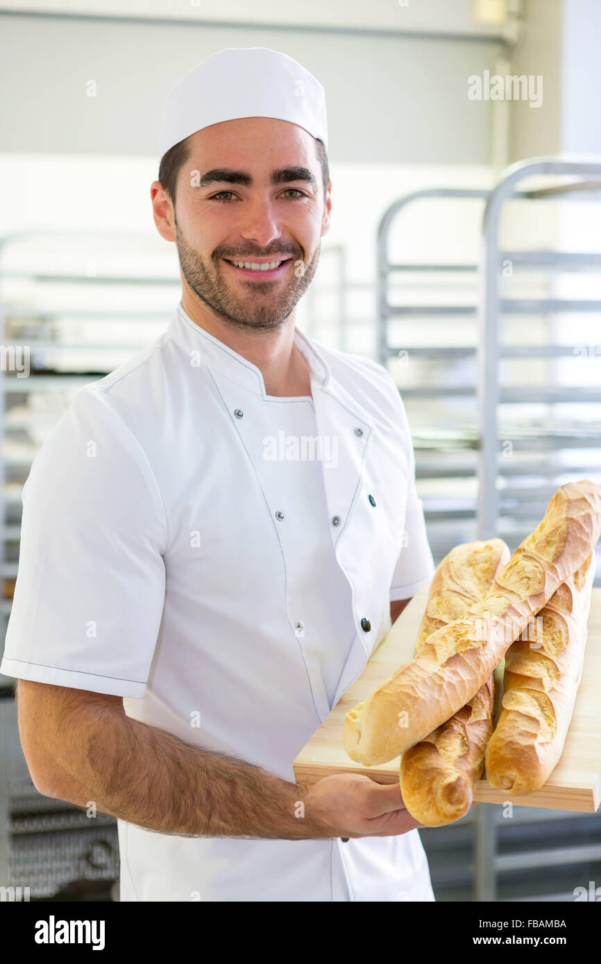 VIew of a Young attarctive baker working at the bakery Stock Photo - Alamy