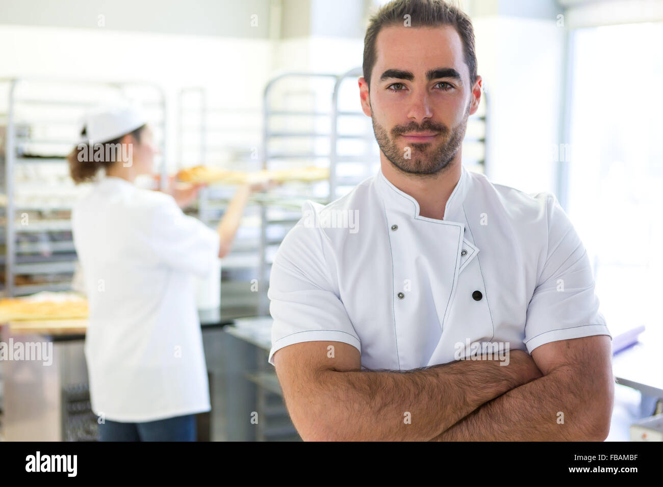 VIew of a Young attarctive baker working at the bakery Stock Photo - Alamy