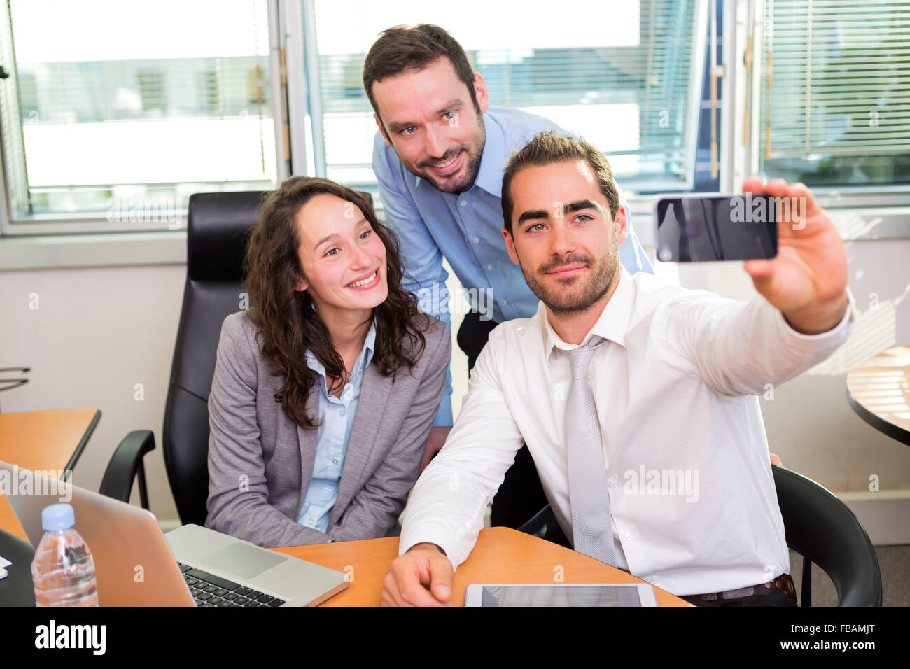 View of a Group of business associates working together at the office ...