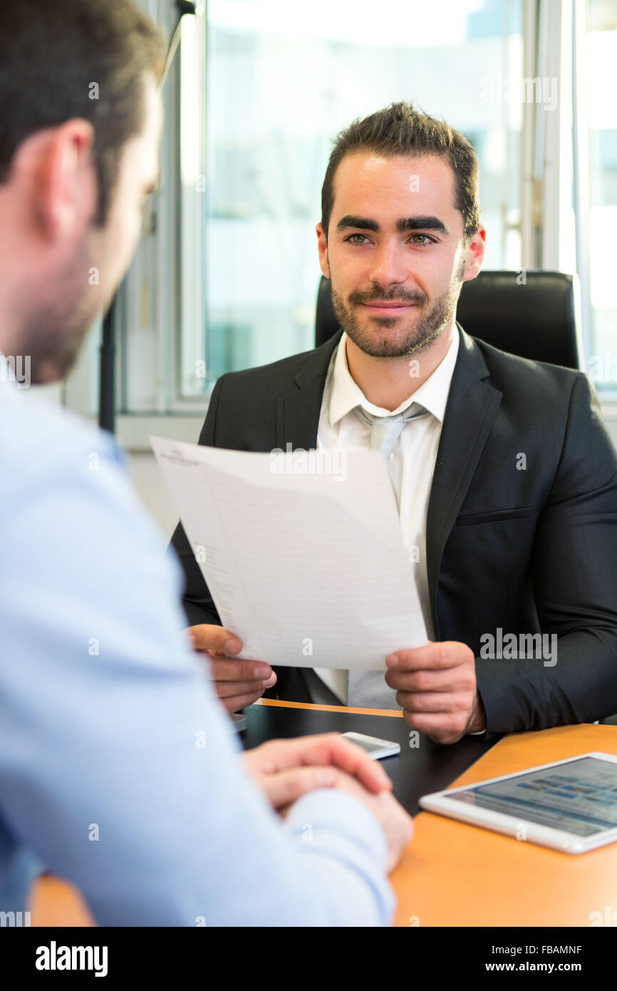 View of a Attractive boss doing interview with his assistant Stock ...