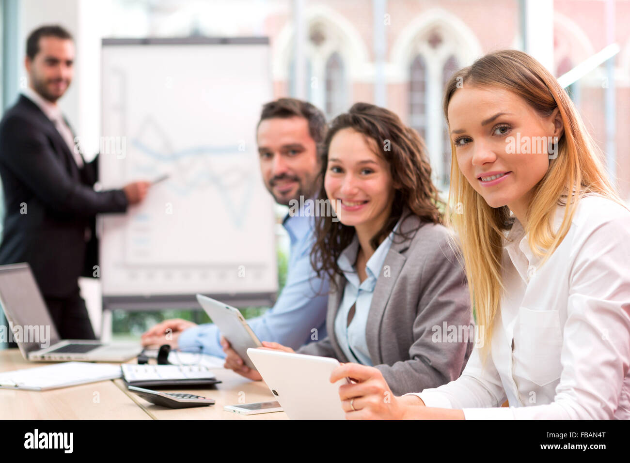 View of a Boss heading a business reunion with partners Stock Photo - Alamy