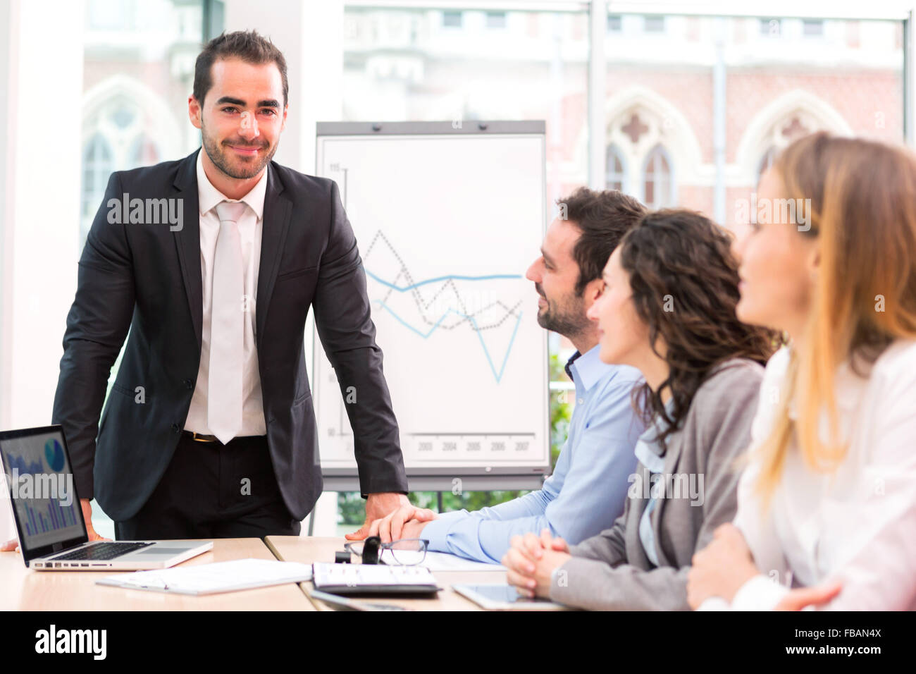 View of a Boss heading a business reunion with partners Stock Photo - Alamy