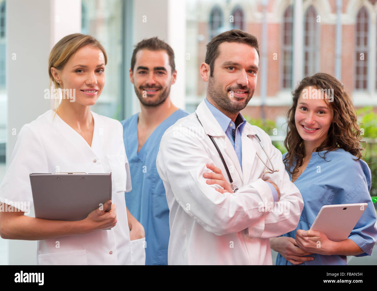 View of a Medical team working at the hospital all together Stock Photo ...