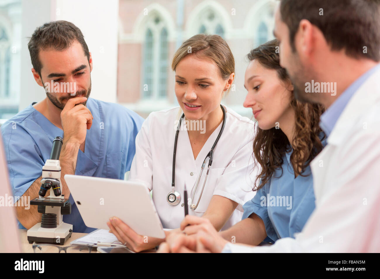 View of a Medical team working at the hospital all together Stock Photo ...