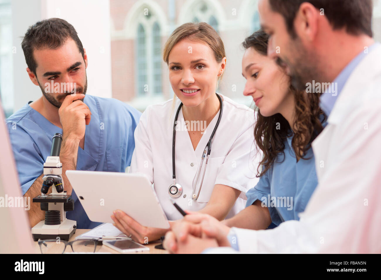 View of a Medical team working at the hospital all together Stock Photo ...