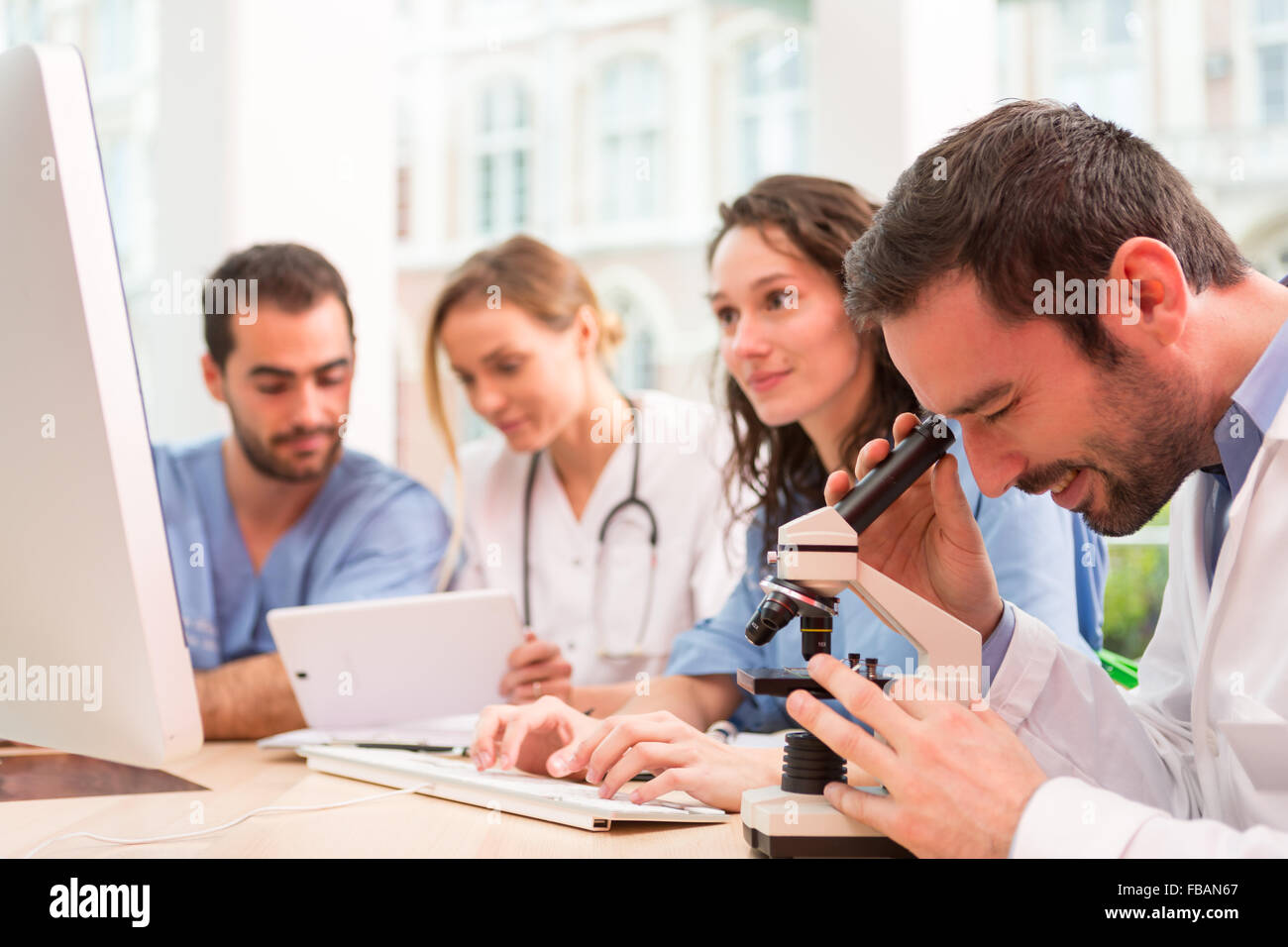 View of a Medical team working at the hospital all together Stock Photo ...