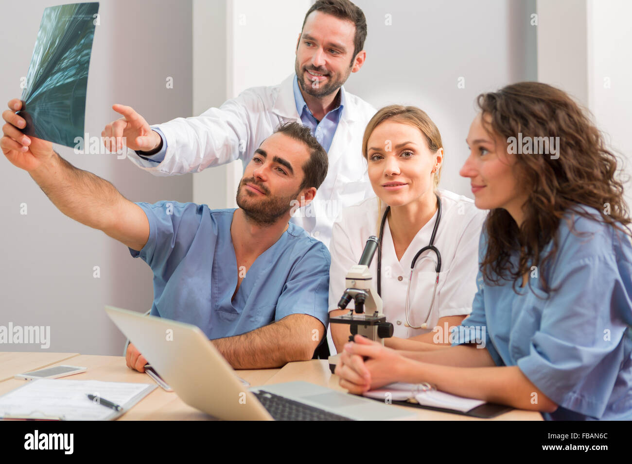 View of a Medical team working at the hospital all together Stock Photo ...