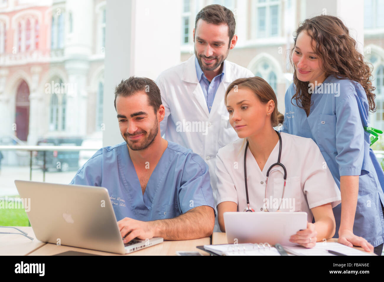 View of a Medical team working at the hospital all together Stock Photo ...