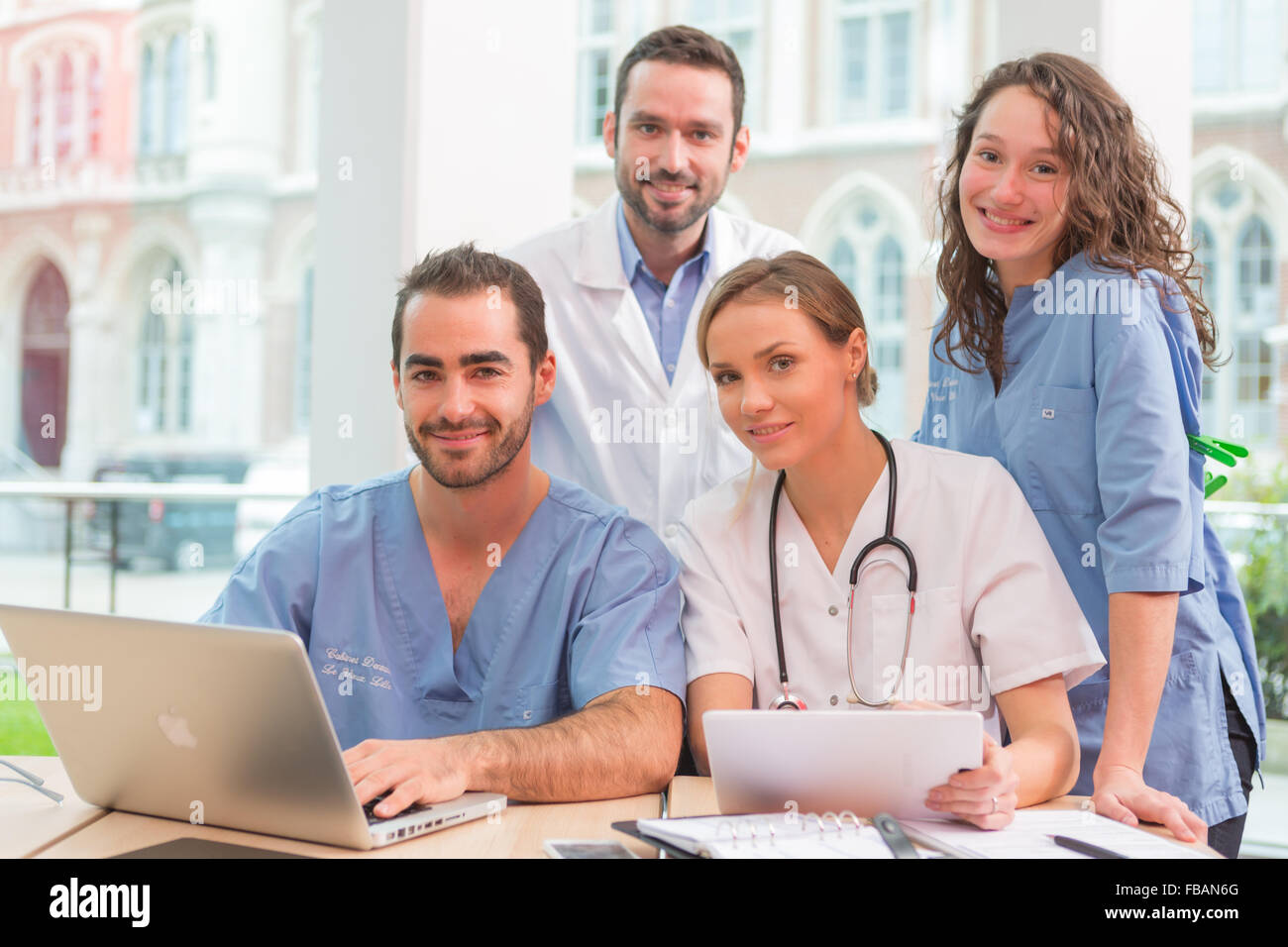 View of a Medical team working at the hospital all together Stock Photo ...