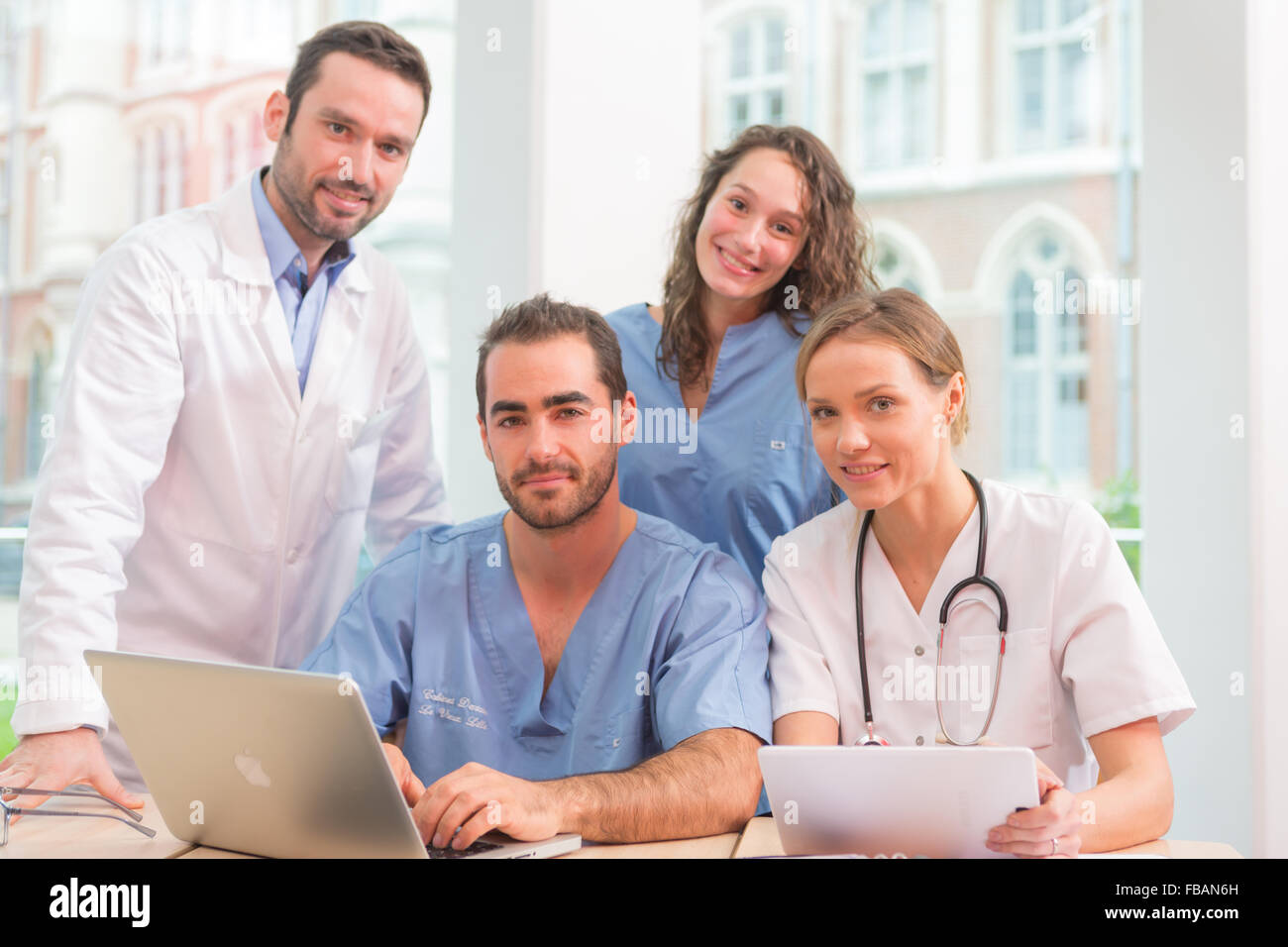 View of a Medical team working at the hospital all together Stock Photo ...