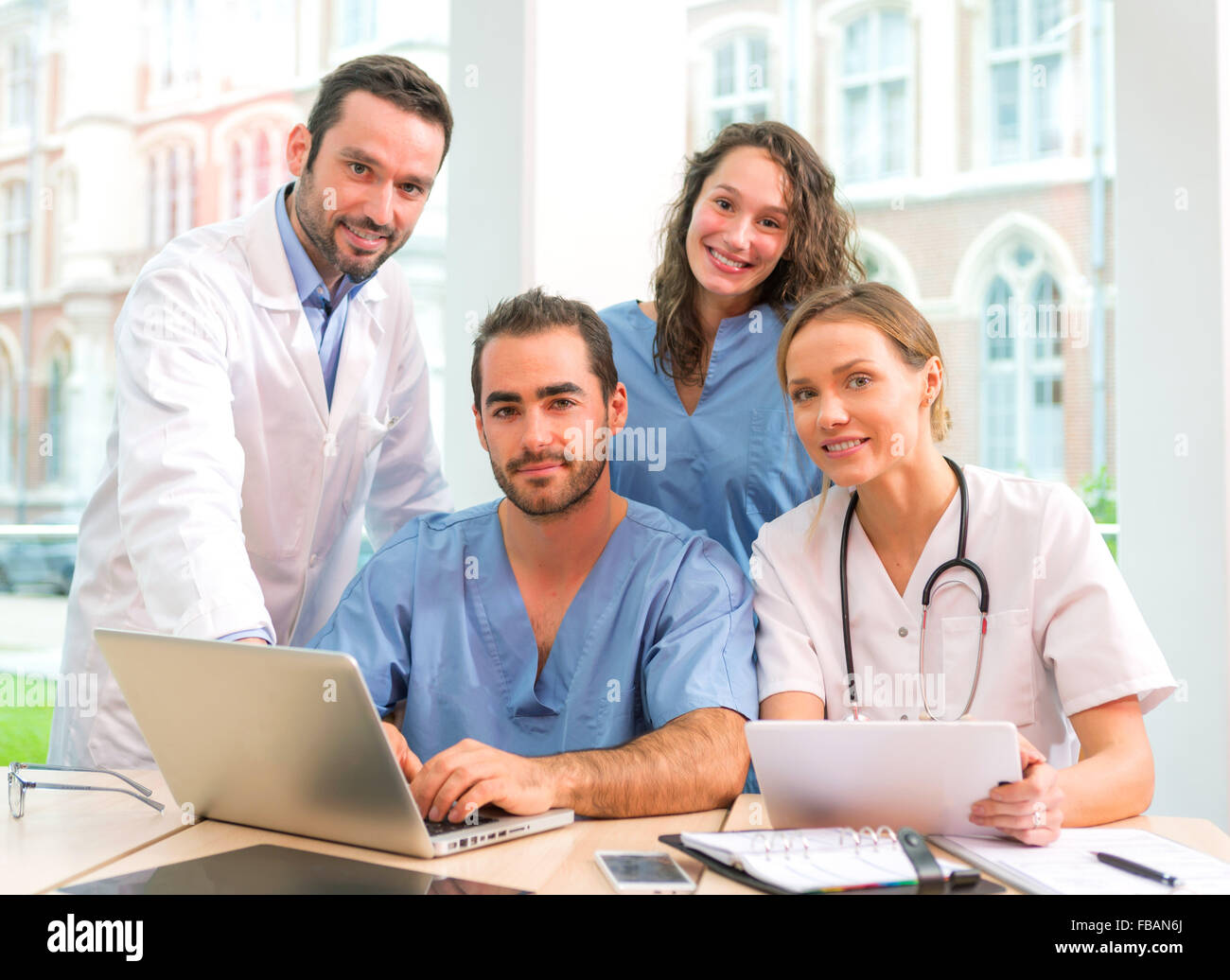 View of a Medical team working at the hospital all together Stock Photo ...