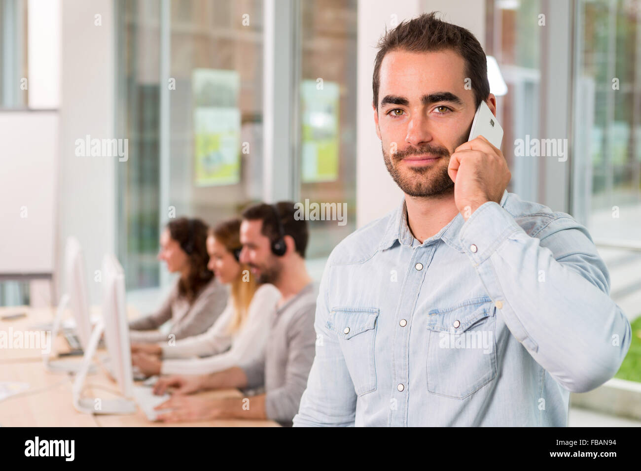 View of a young attractive man at work Stock Photo - Alamy
