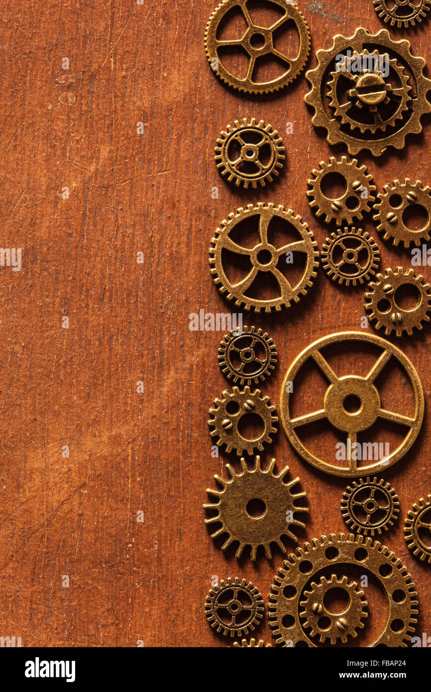 steampunk mechanical cogs gears wheels on wooden background Stock Photo ...