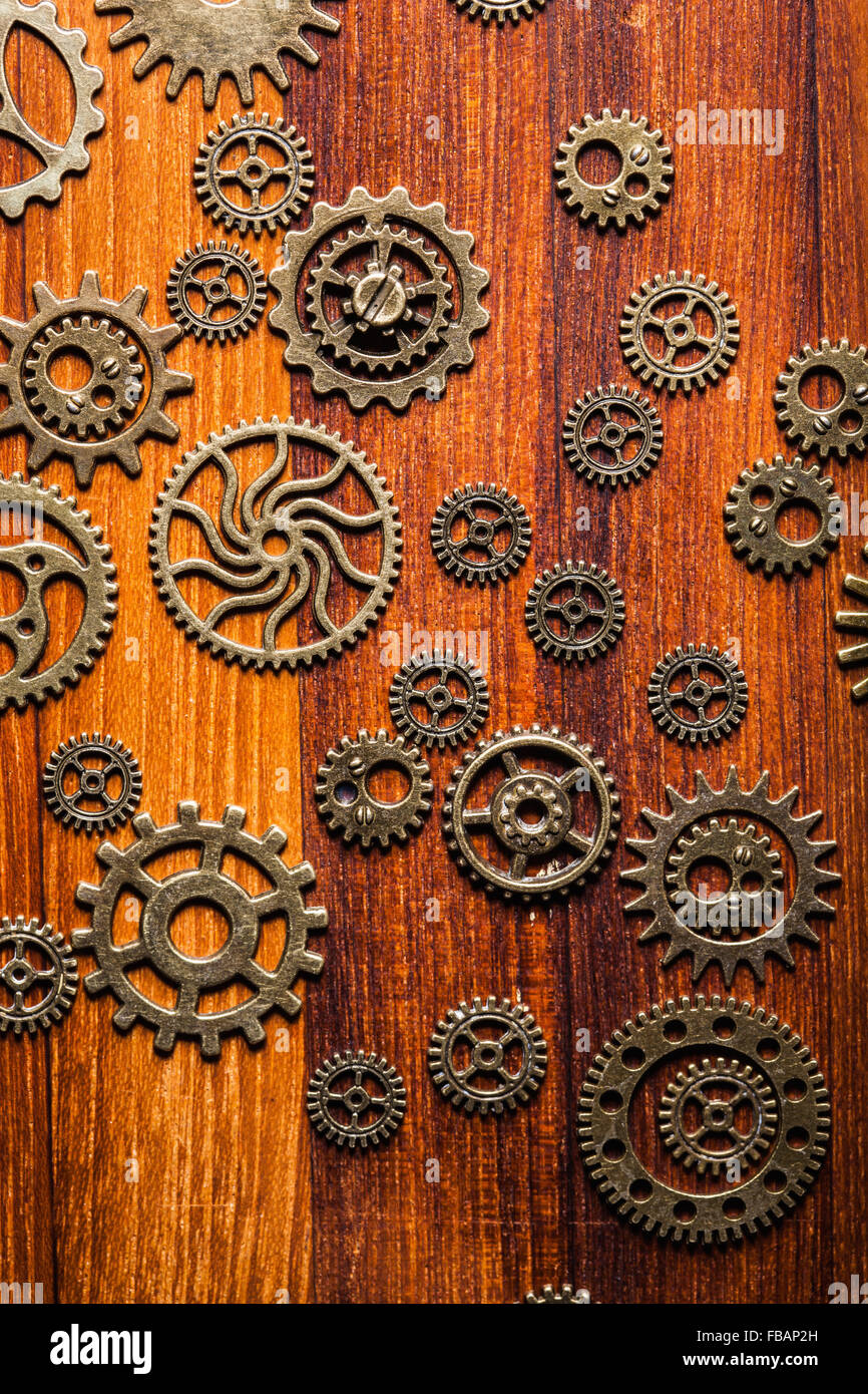 steampunk mechanical cogs gears wheels on wooden background Stock Photo ...