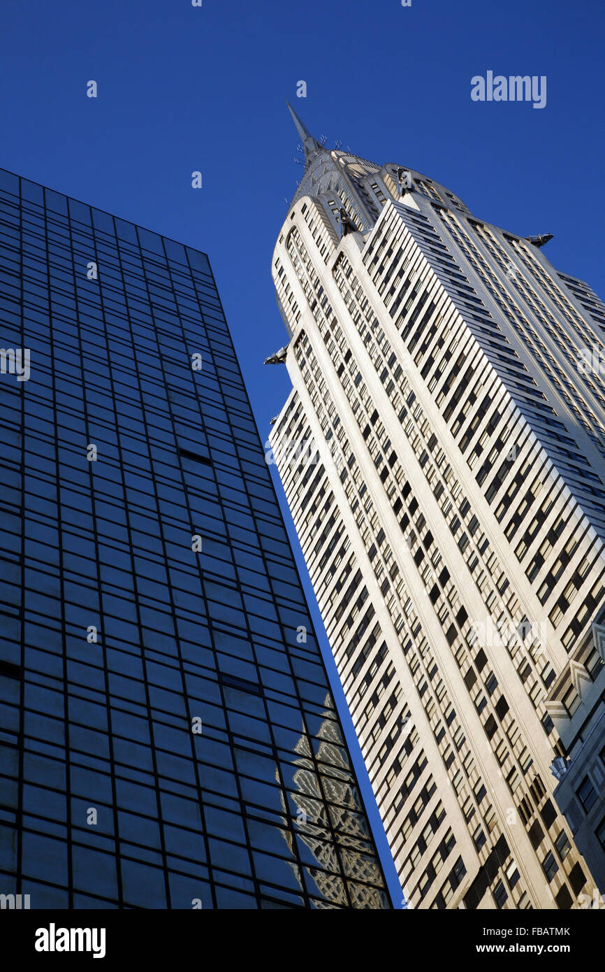 Iconic Chrysler Building & Calyon Building standing against clear blue ...