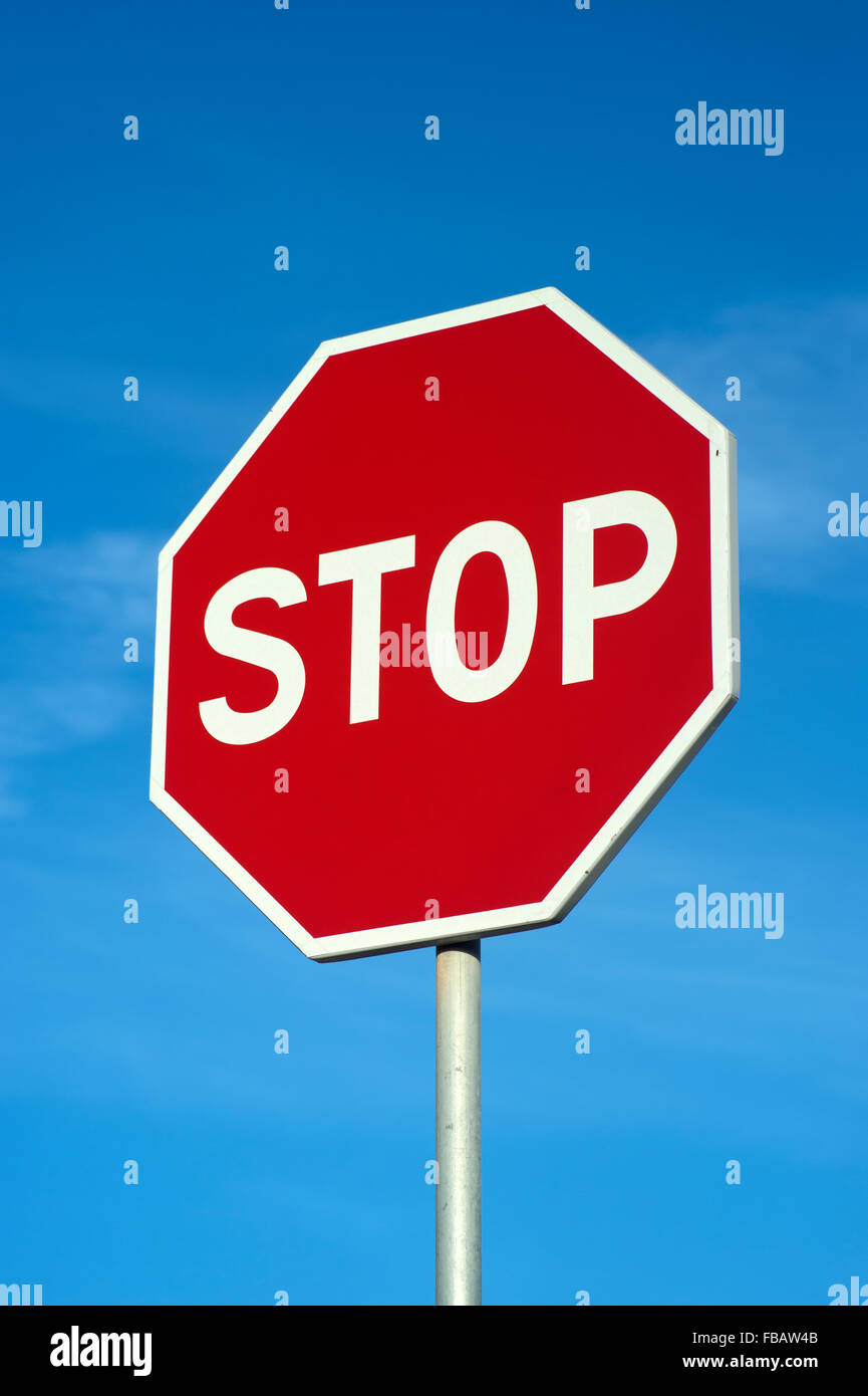 Red stop sign against a blue sky Stock Photo - Alamy