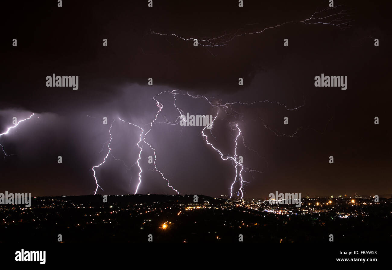lightning over city Stock Photo - Alamy