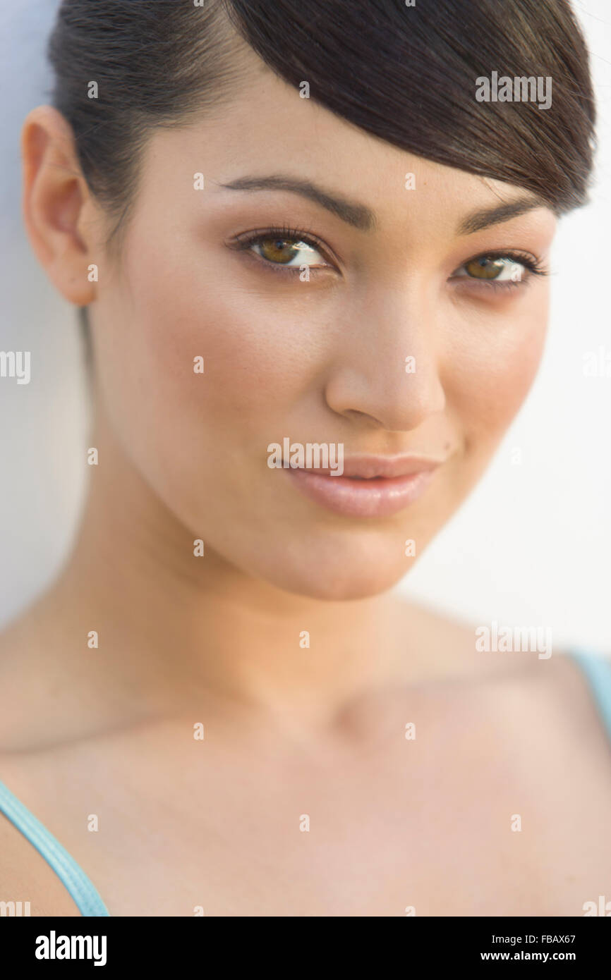 Portrait of a dark-haired young woman Stock Photo - Alamy