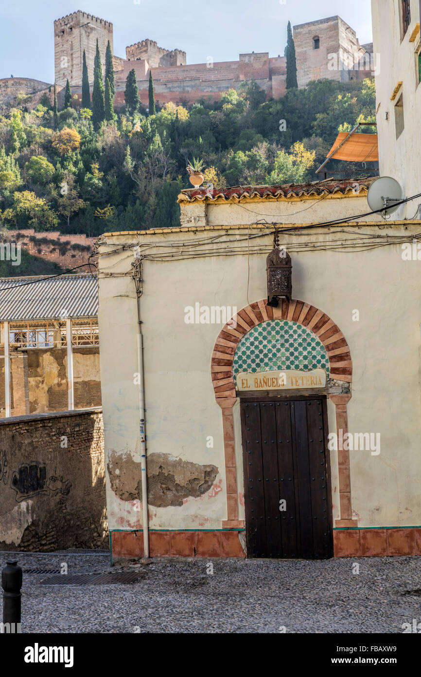 Arabic bar with an arch and traditional ceramic tiles in the foreground ...