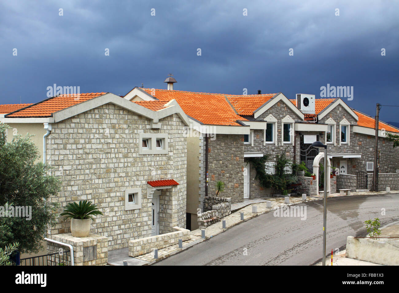 Common Balkans buildings in Sveti Stefan, Montenegro Stock Photo - Alamy