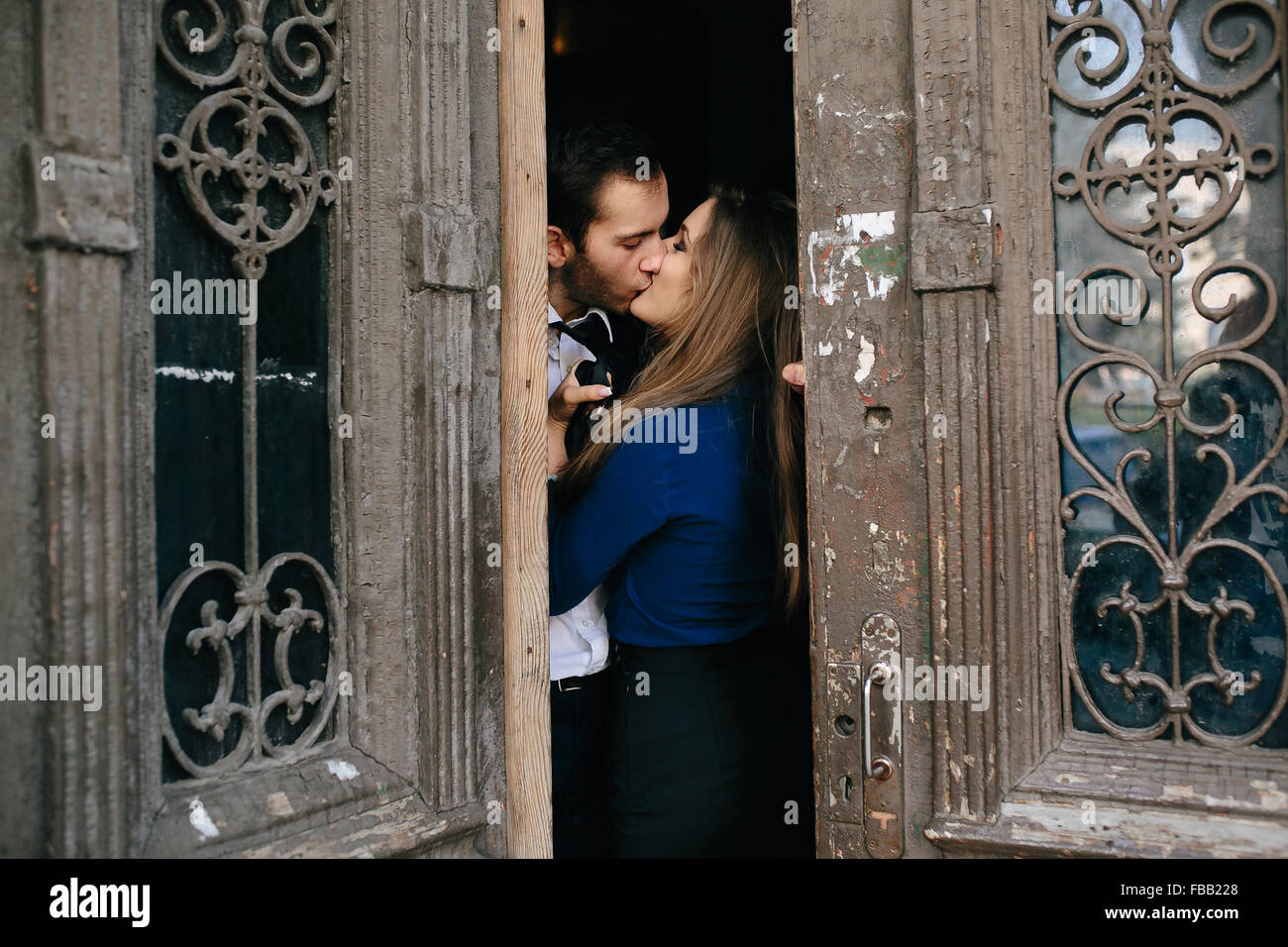 man and woman posing in door Stock Photo - Alamy