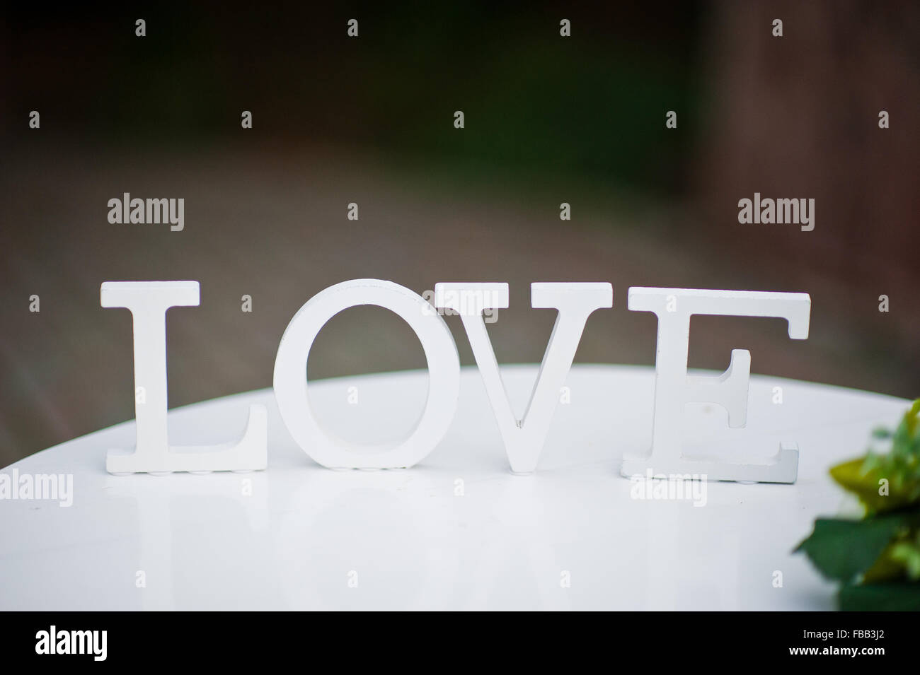 Decor word LOVE on table wedding ceremony Stock Photo - Alamy
