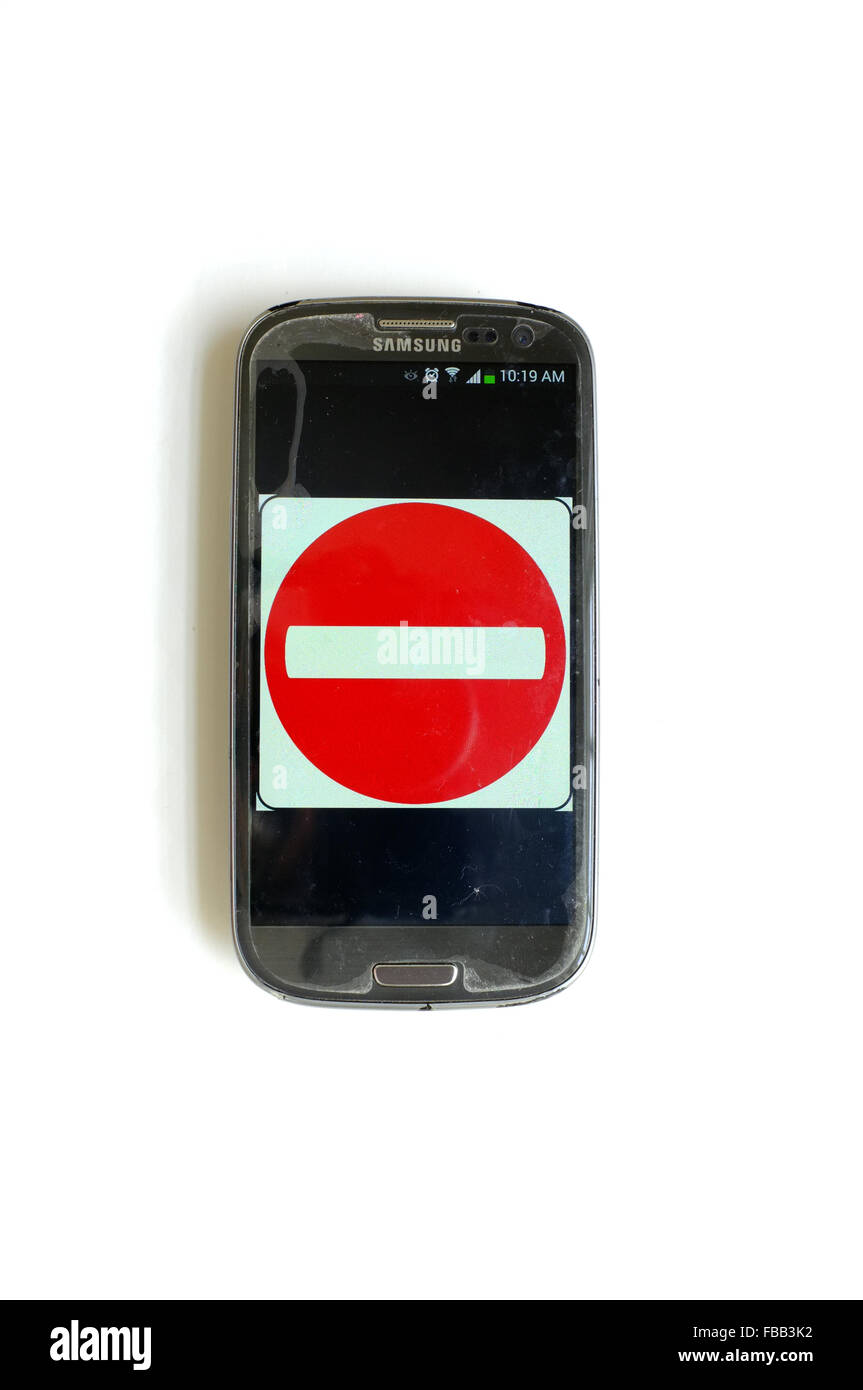 A No Entry sign on a smartphone screen photographed against a white ...