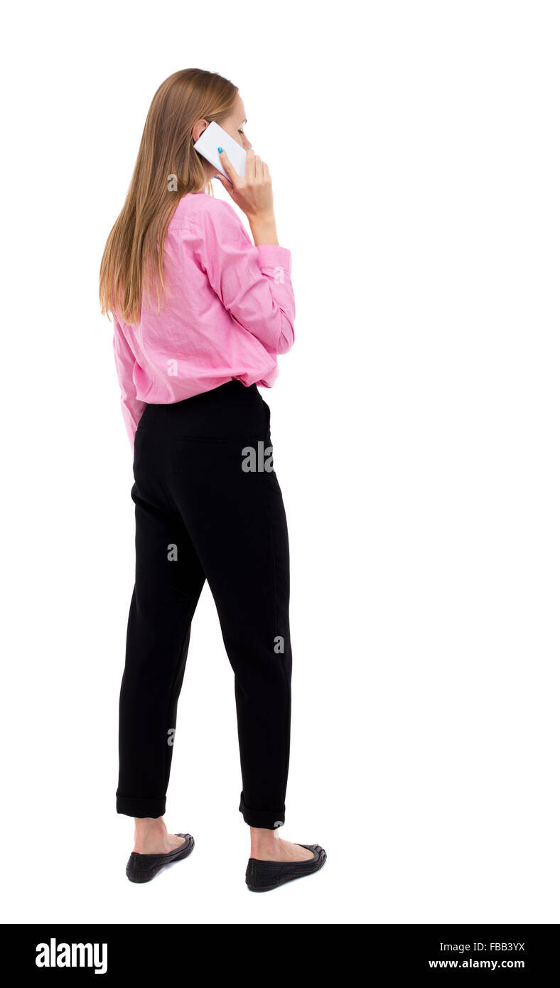 back view of a woman talking on the phone. backside view of person ...