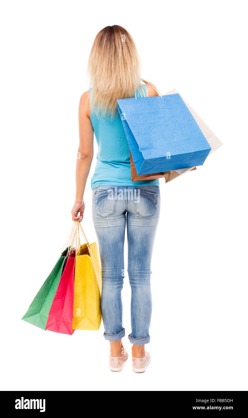 back view of woman with shopping bags . beautiful brunette girl in ...