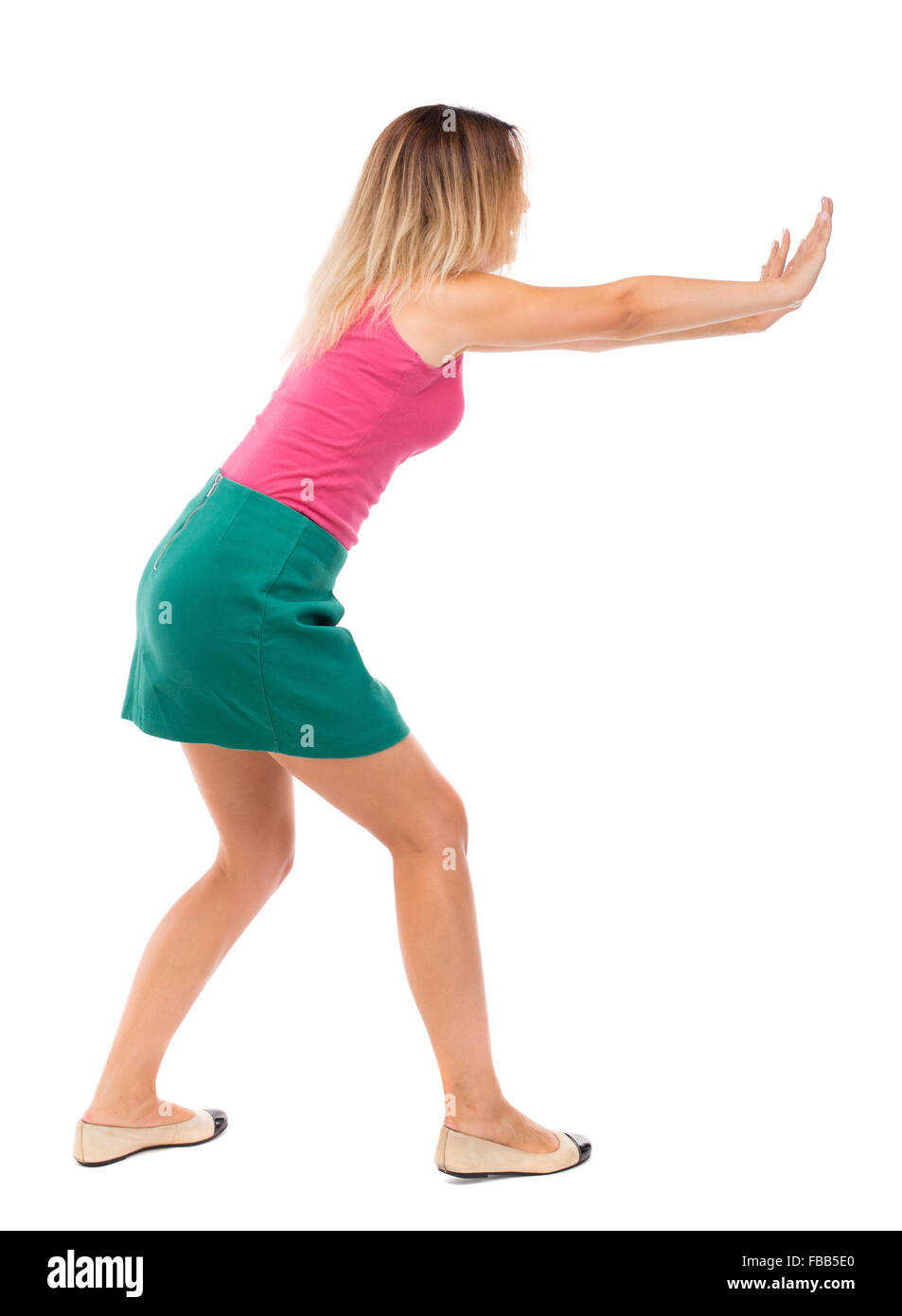 back view of woman pushes wall. Isolated over white background. Rear ...
