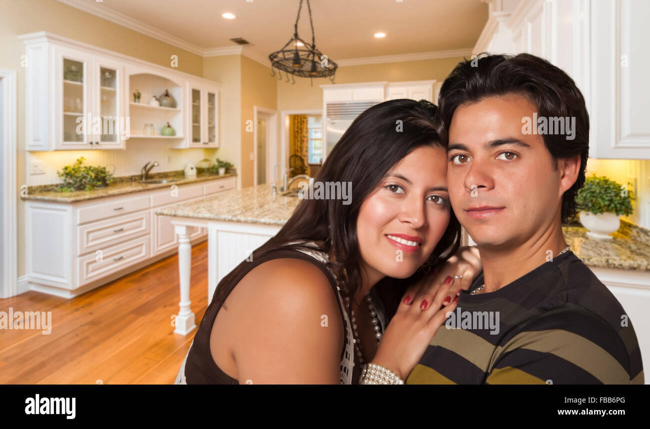 Affectionate Hispanic Couple Inside Custom Kitchen Interior Stock Photo ...