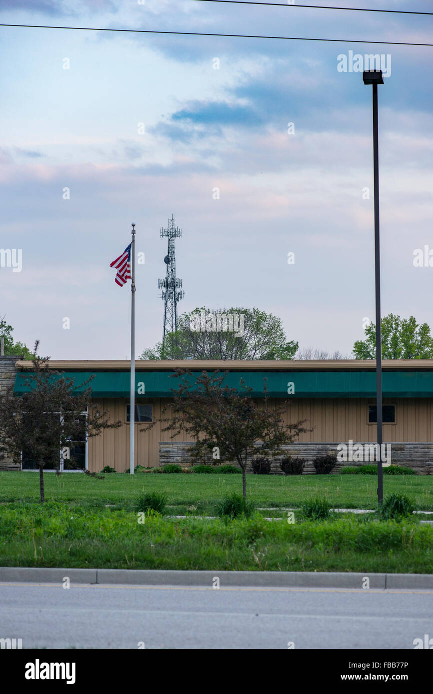 American flag flying in front of a building at sunset Stock Photo - Alamy