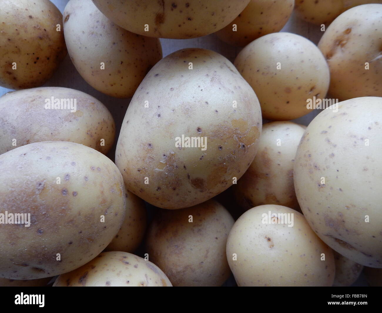 some potatoes on a table Stock Photo - Alamy