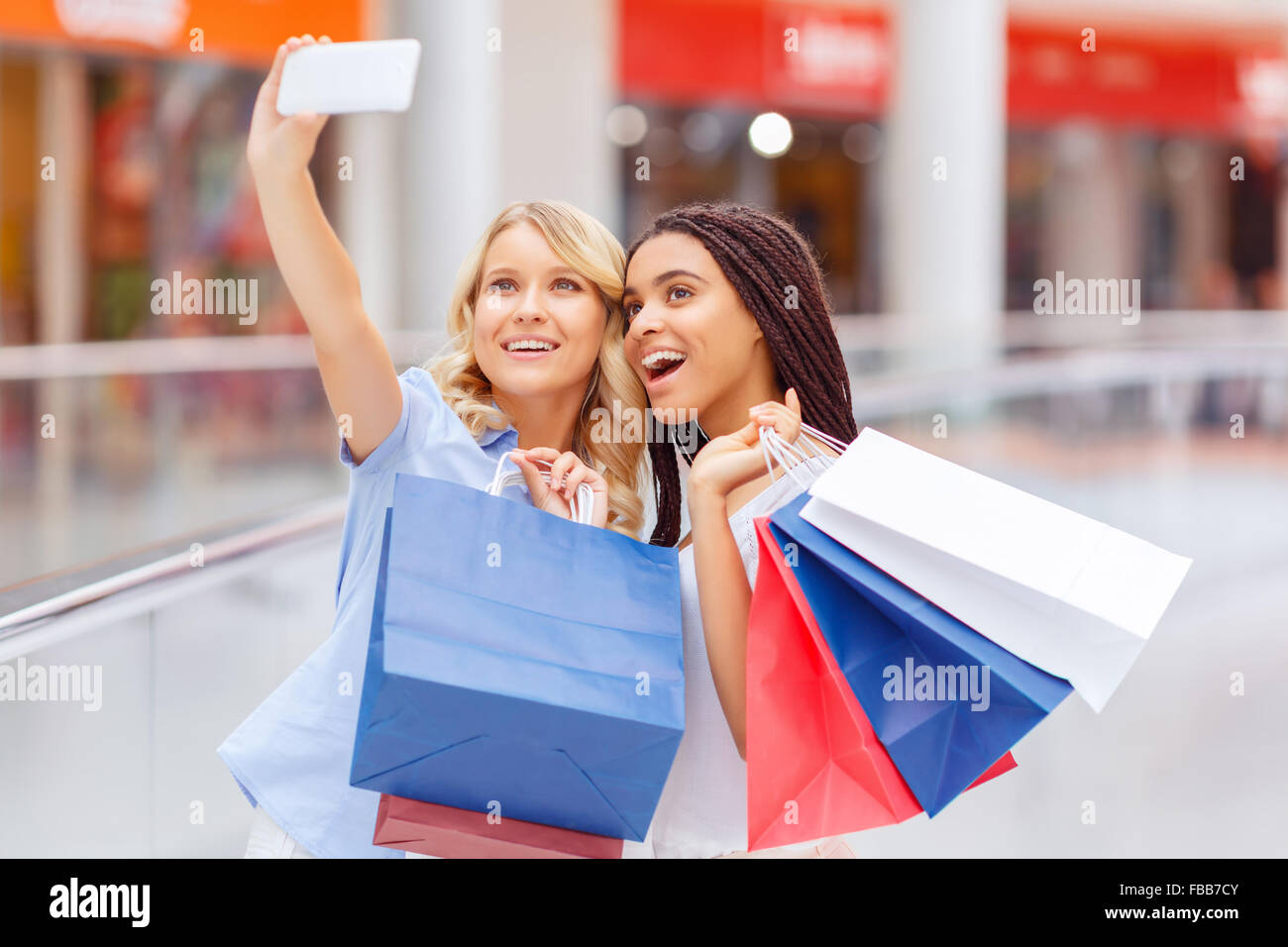 Pretty girls making shopping Stock Photo - Alamy