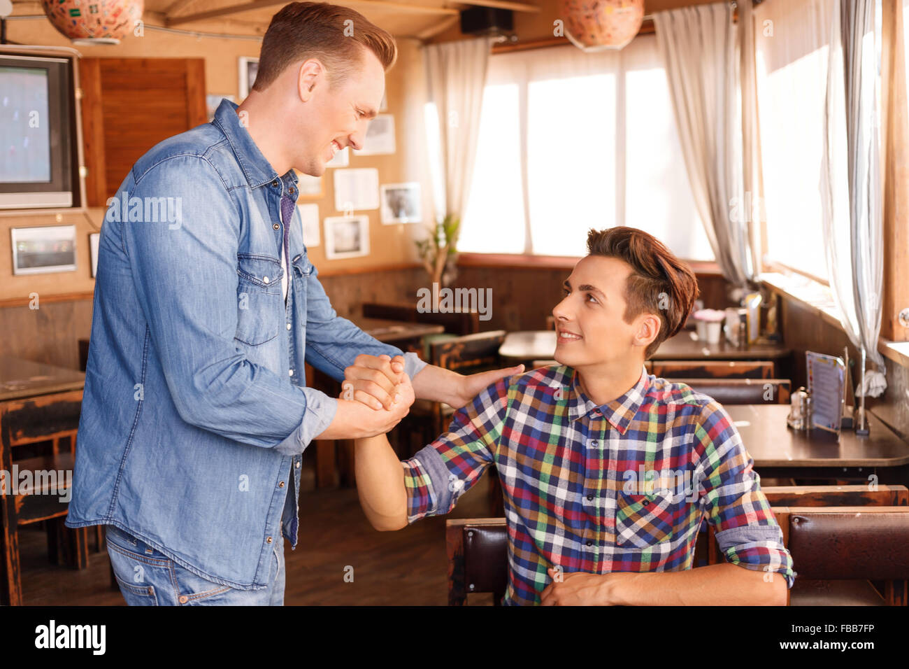 Two guys greeting each other Stock Photo - Alamy