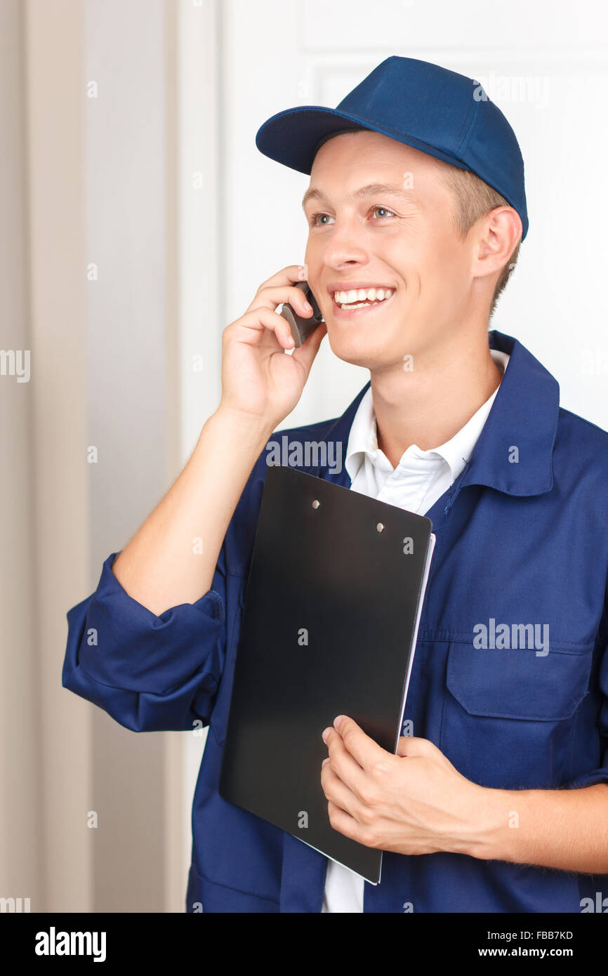 Deliveryman Talking On Mobile Phone Stock Photo Alamy deliveryman-talking-on-mobile-phone-stock-photo-alamy