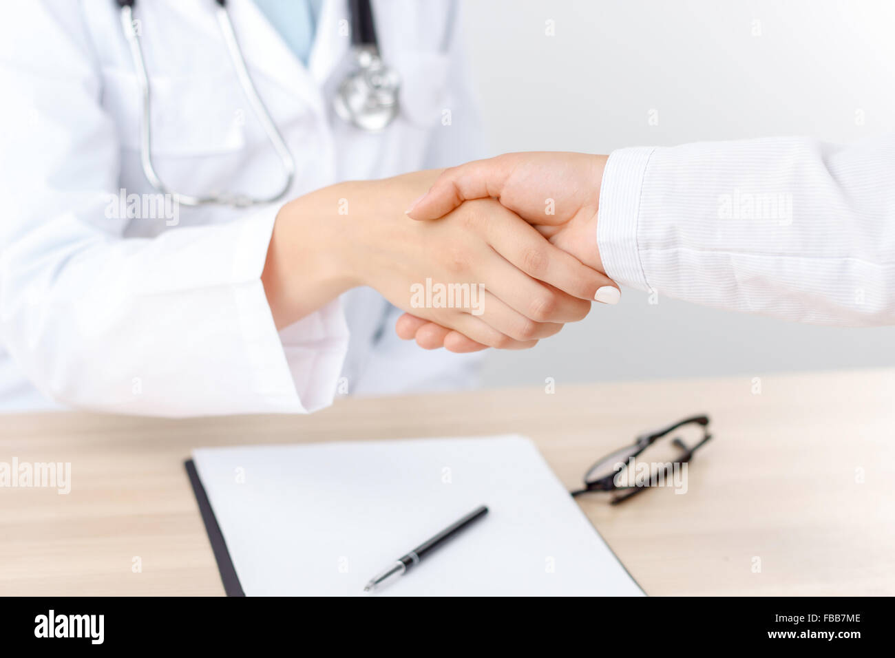 Professional doctor shaking hands Stock Photo - Alamy